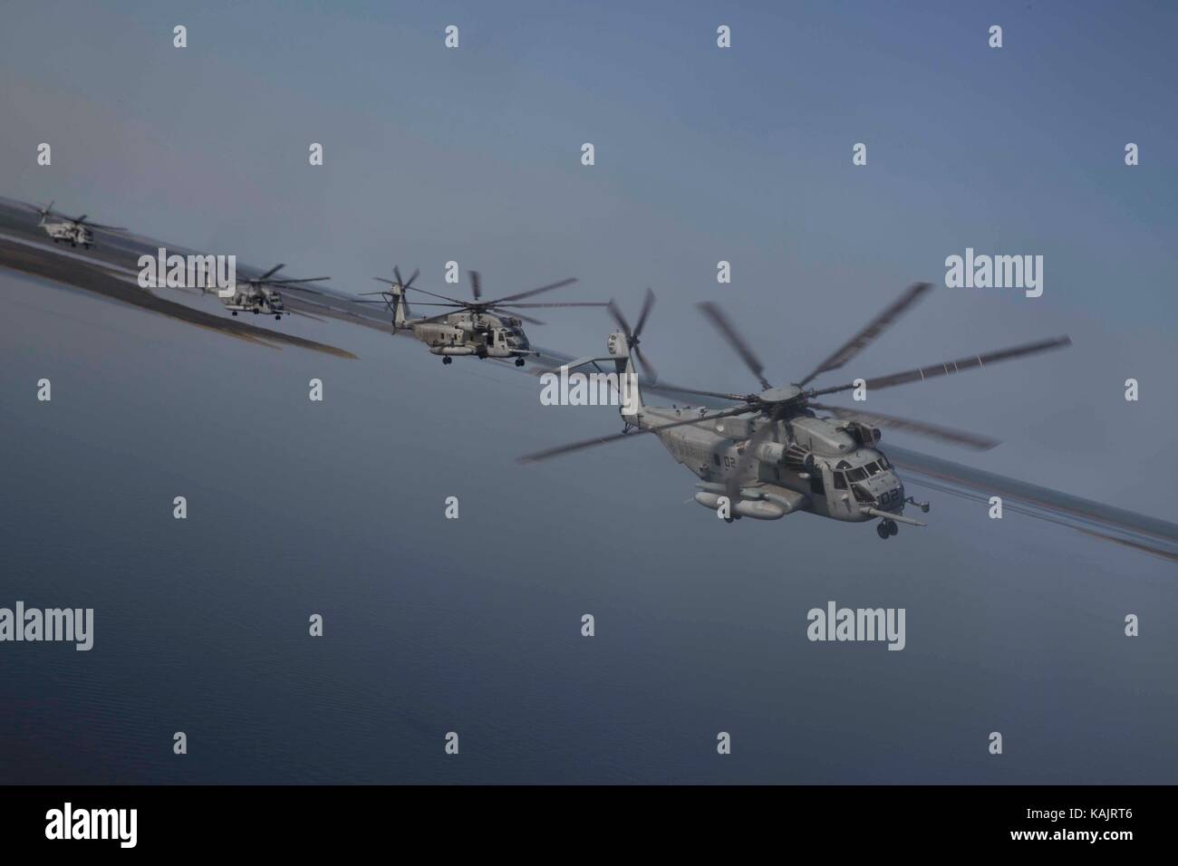 Four CH-53 Super Stallions conduct an in-flight turn during a formation ...