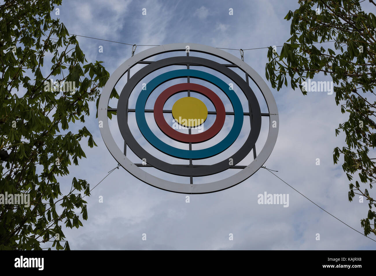 Colourful target hanging between two trees Stock Photo - Alamy