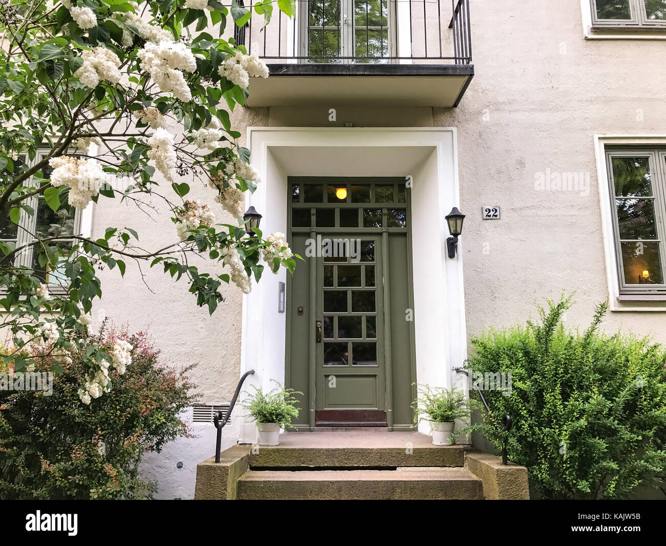 Flowers front a window. Floral facade Stock Photo - Alamy