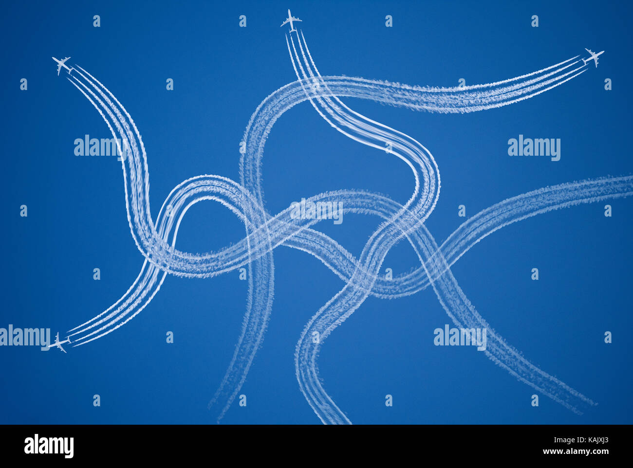 Chaotic, confused, stressful symbol of tangled aircraft vapor trails ...