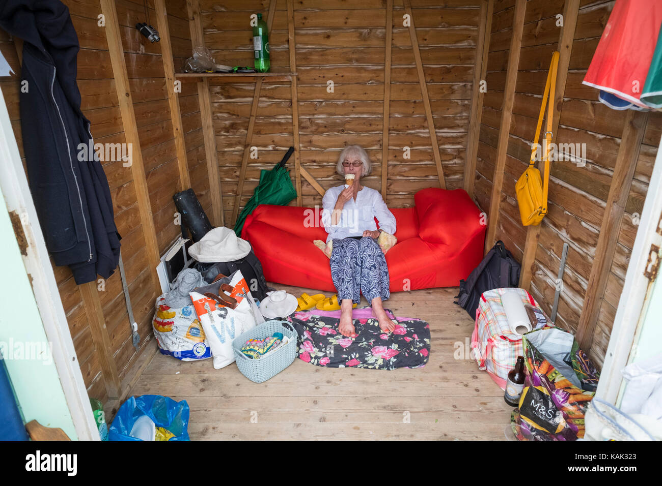 Lady relaxing in a beach hut hi-res stock photography and images - Alamy