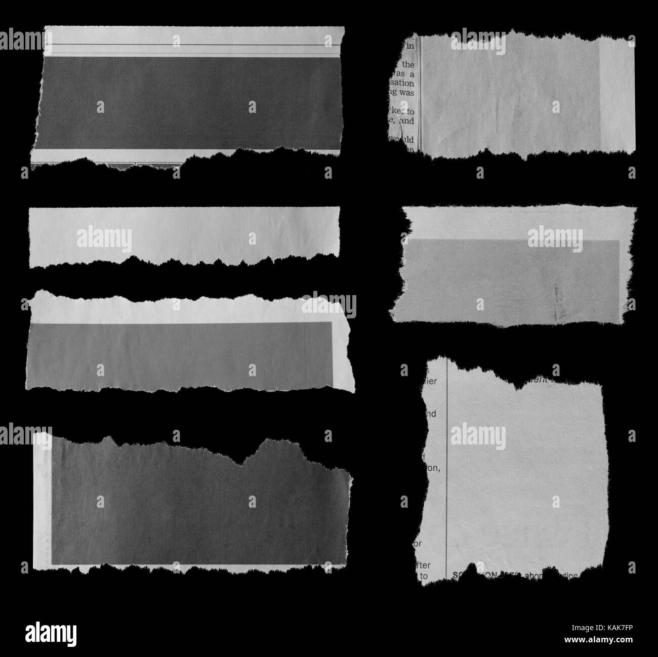 Pieces of torn paper on black Stock Photo - Alamy