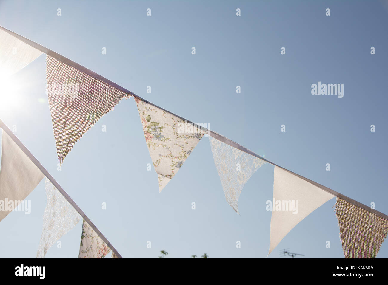 natural coloured bunting in a blue sky Stock Photo - Alamy