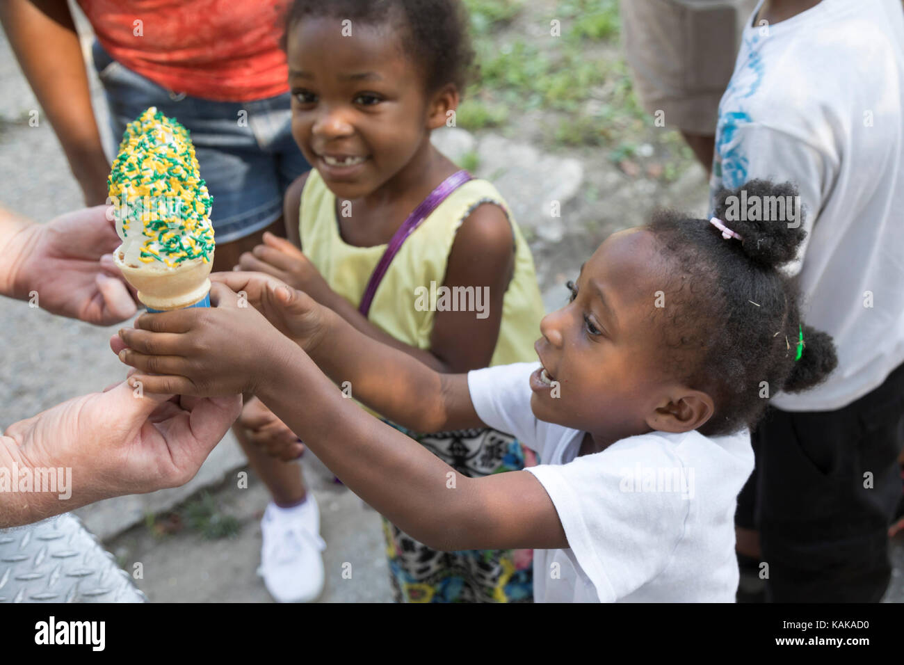 Detroit, Michigan - Children get cones of frozen custard at a block ...
