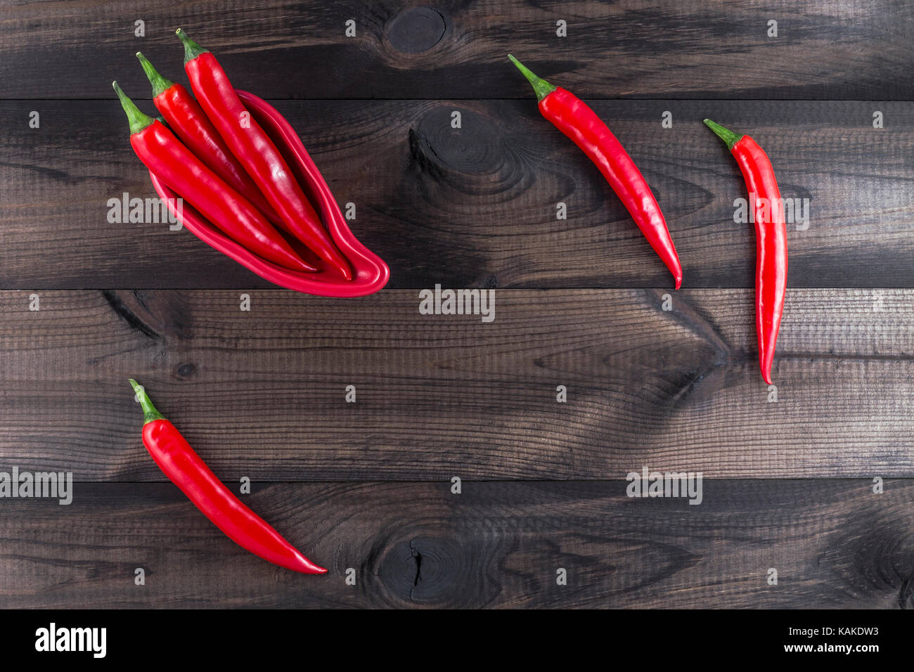 cayenne chilli peppers on wooden background Stock Photo - Alamy