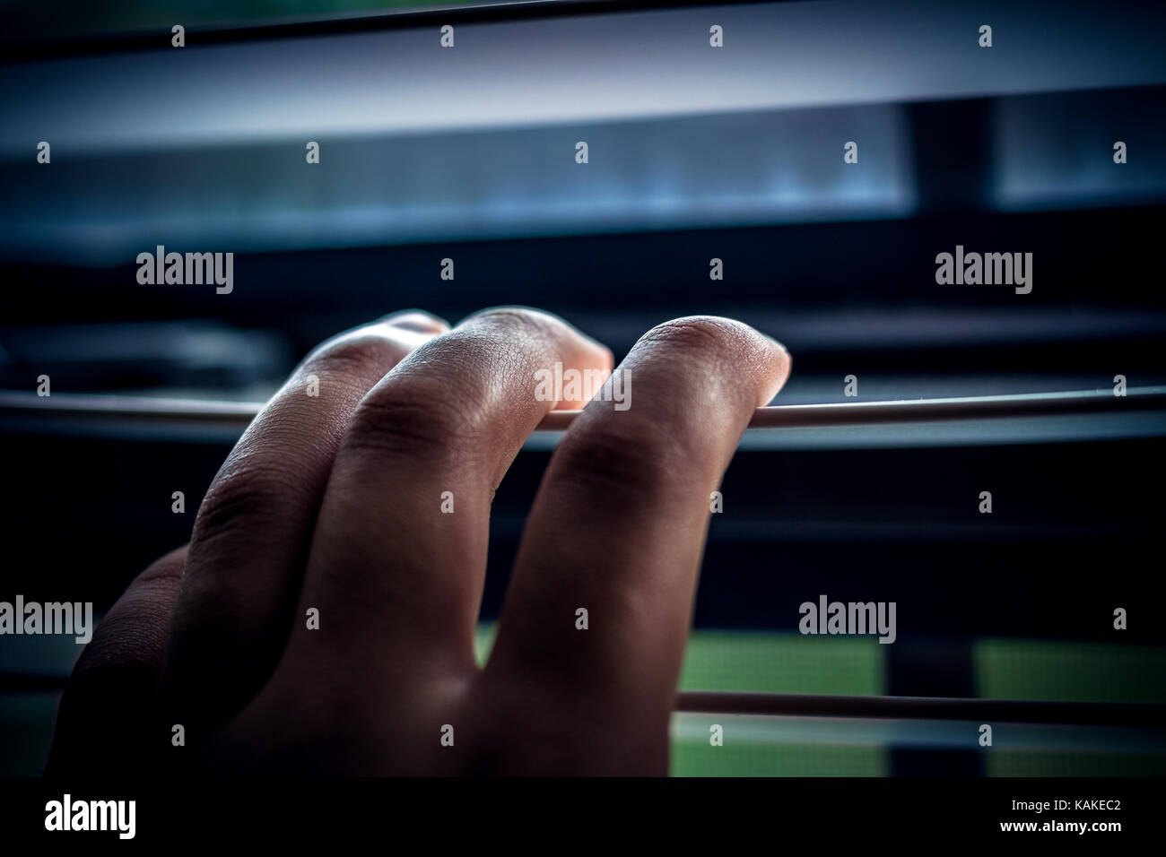 Hand on Window Blinds Stock Photo - Alamy