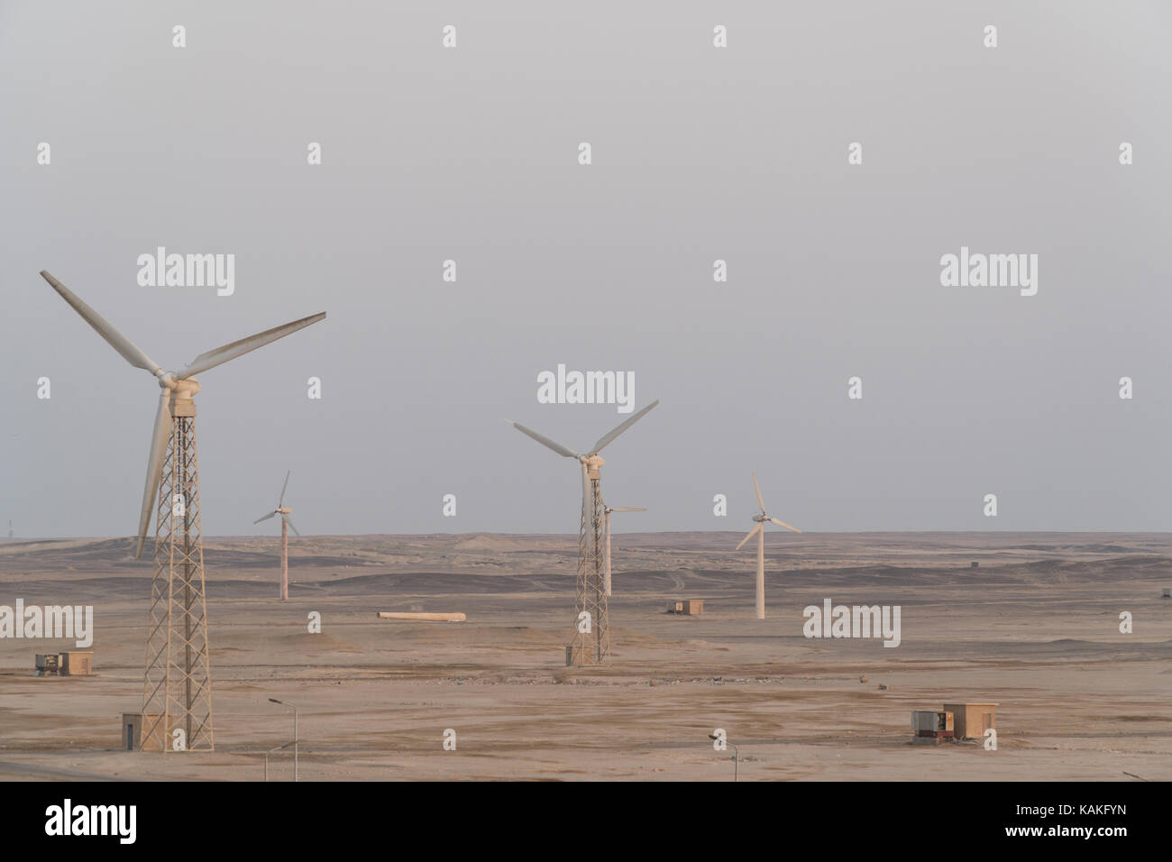Windmills in the desert. Wind power. Sunset Stock Photo - Alamy