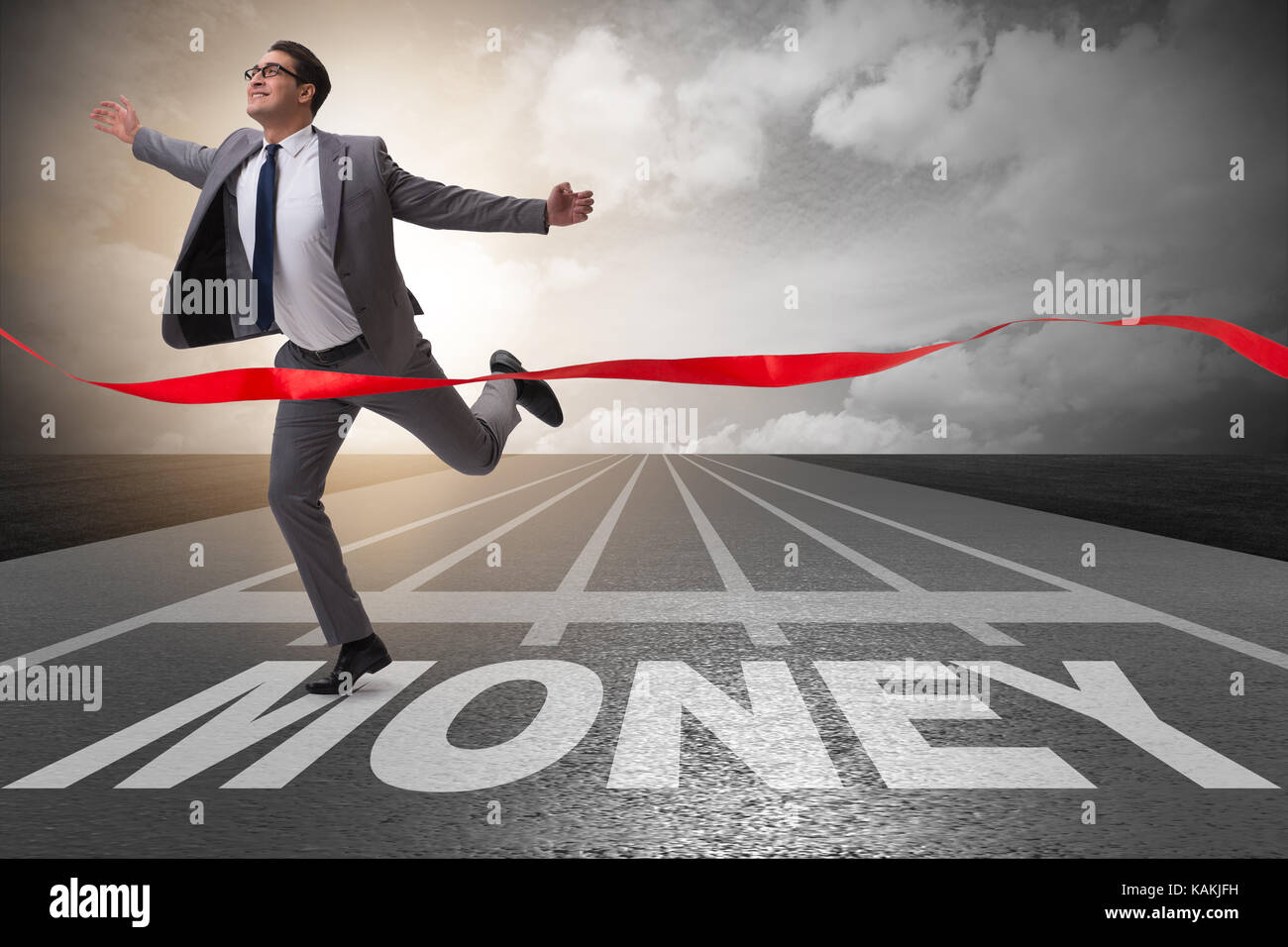 Businessman running towards money on track Stock Photo - Alamy
