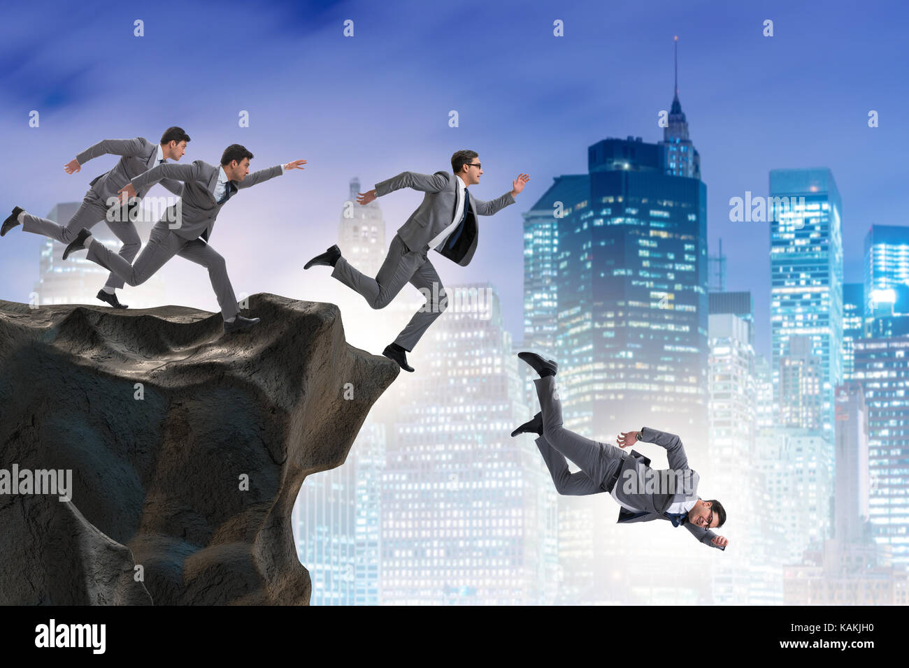 Business people falling off the cliff Stock Photo - Alamy