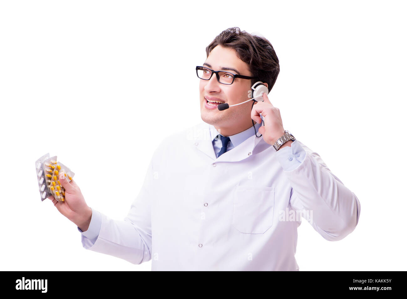 Young doctor with phone headset isolated on white Stock Photo - Alamy