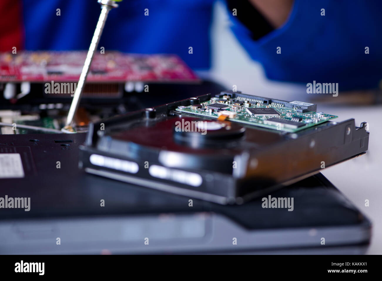 Repairman working in technical support fixing computer laptop ...