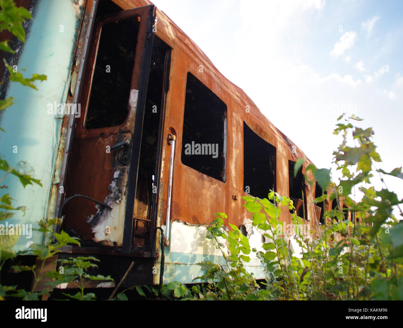 Rusty, burned and destroyed old railway wagon Stock Photo - Alamy