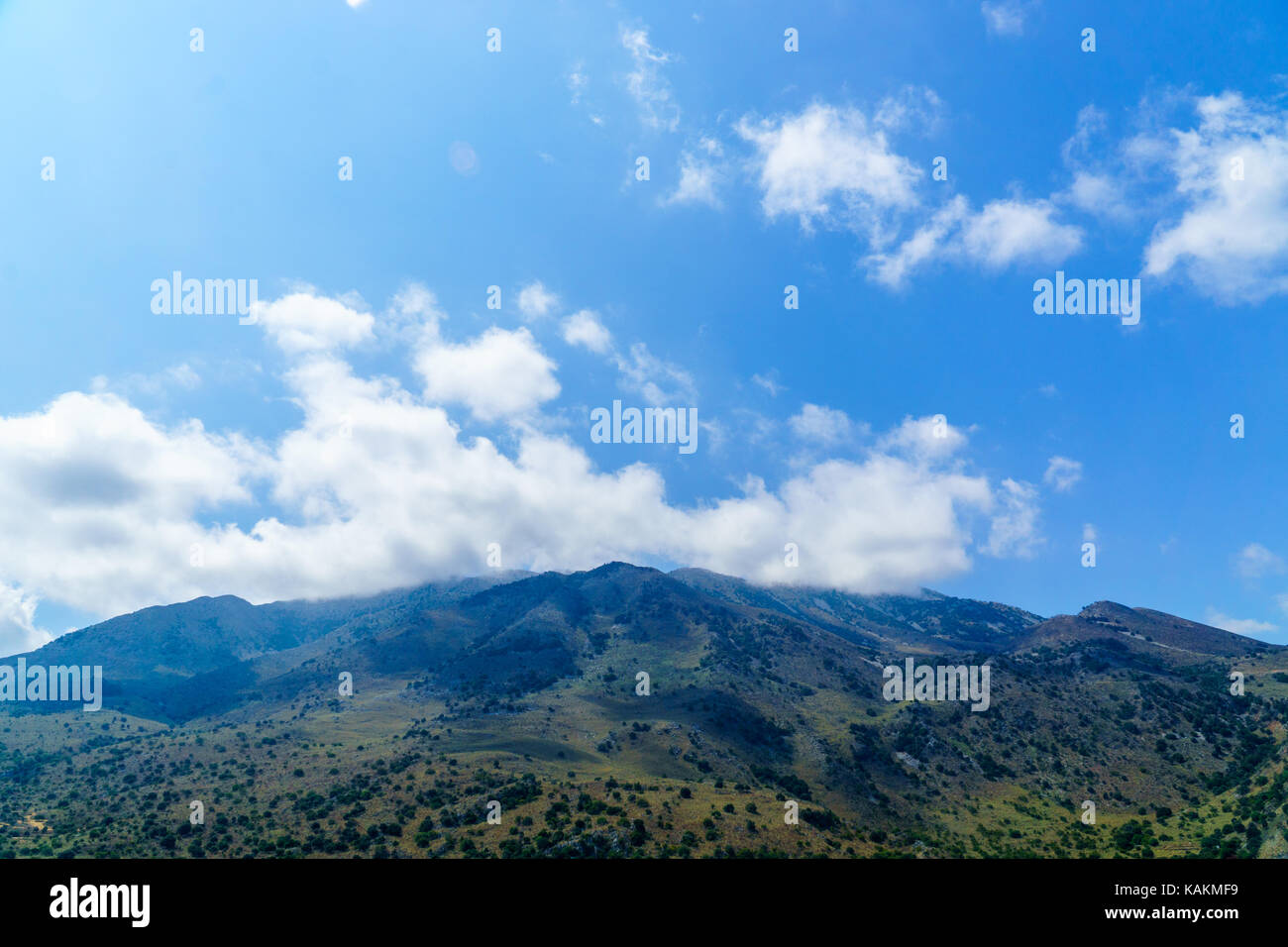 Blue sky with cloud an mountains on crete greece Stock Photo - Alamy