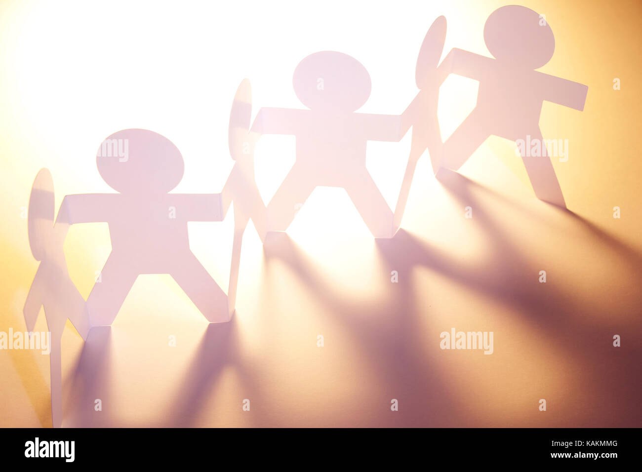 Team of paper chain people Stock Photo - Alamy