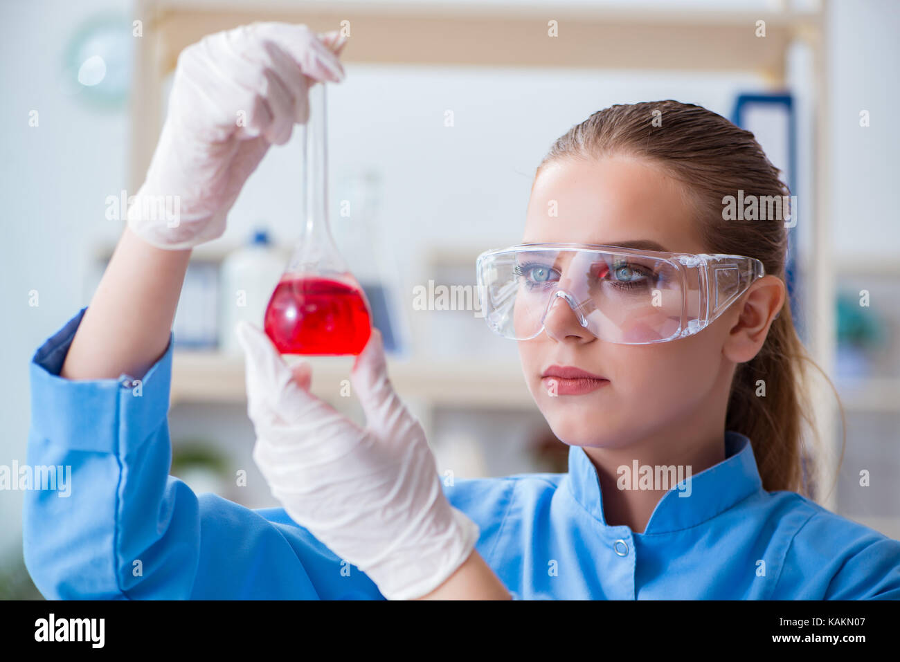 Female scientist researcher conducting an experiment in a laboratory ...