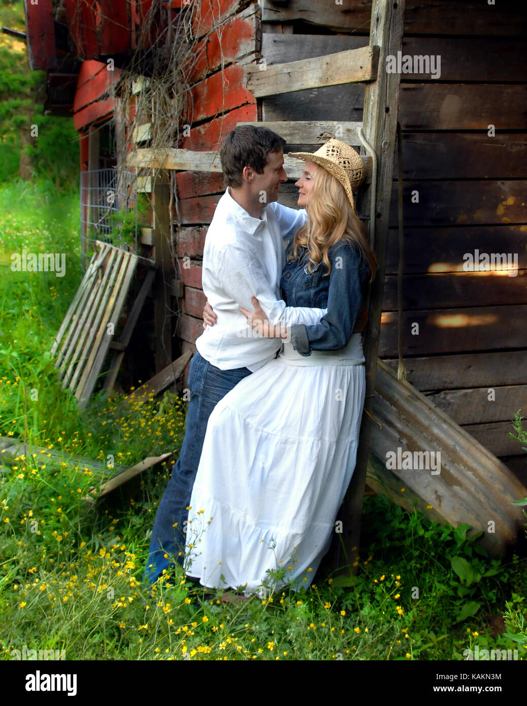 Rustic, weathered barn serves as backdrop for romantic couple. They ...