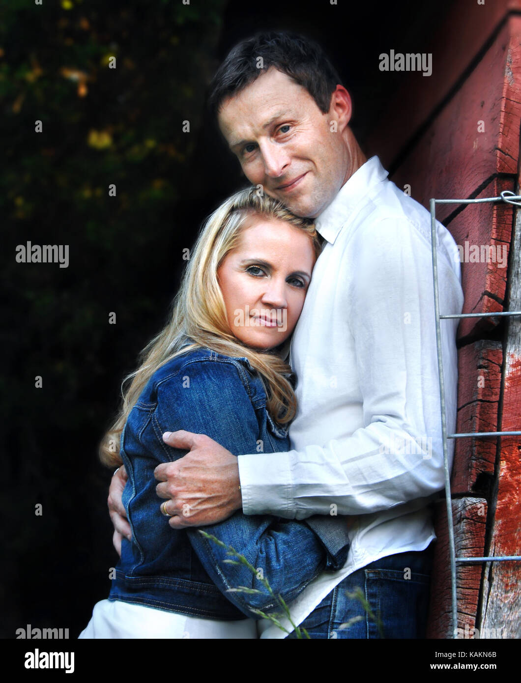 Young couple lean close, trusting in the strength of their marriage ...