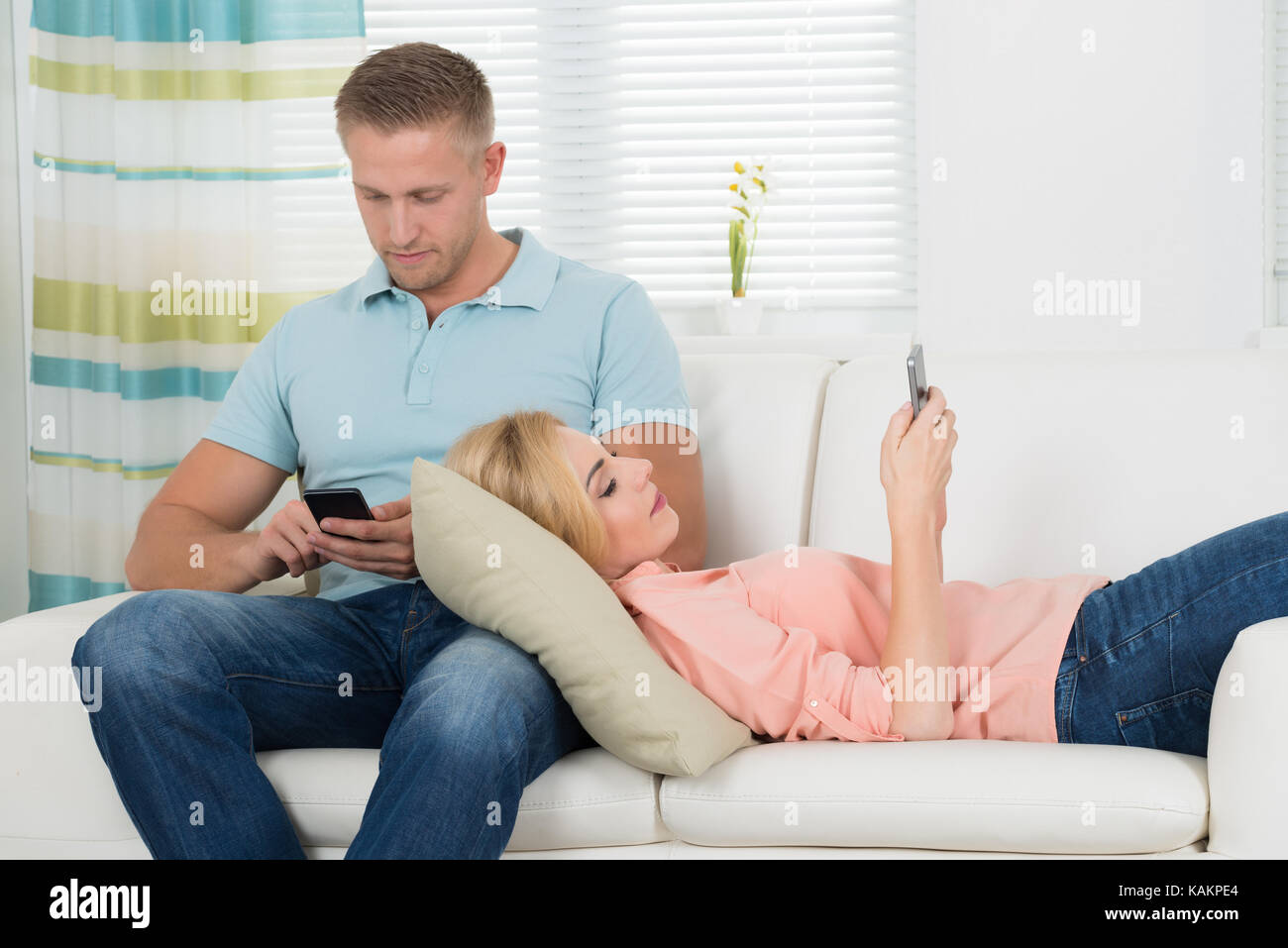 Two women on mobile phones hi-res stock photography and images - Alamy