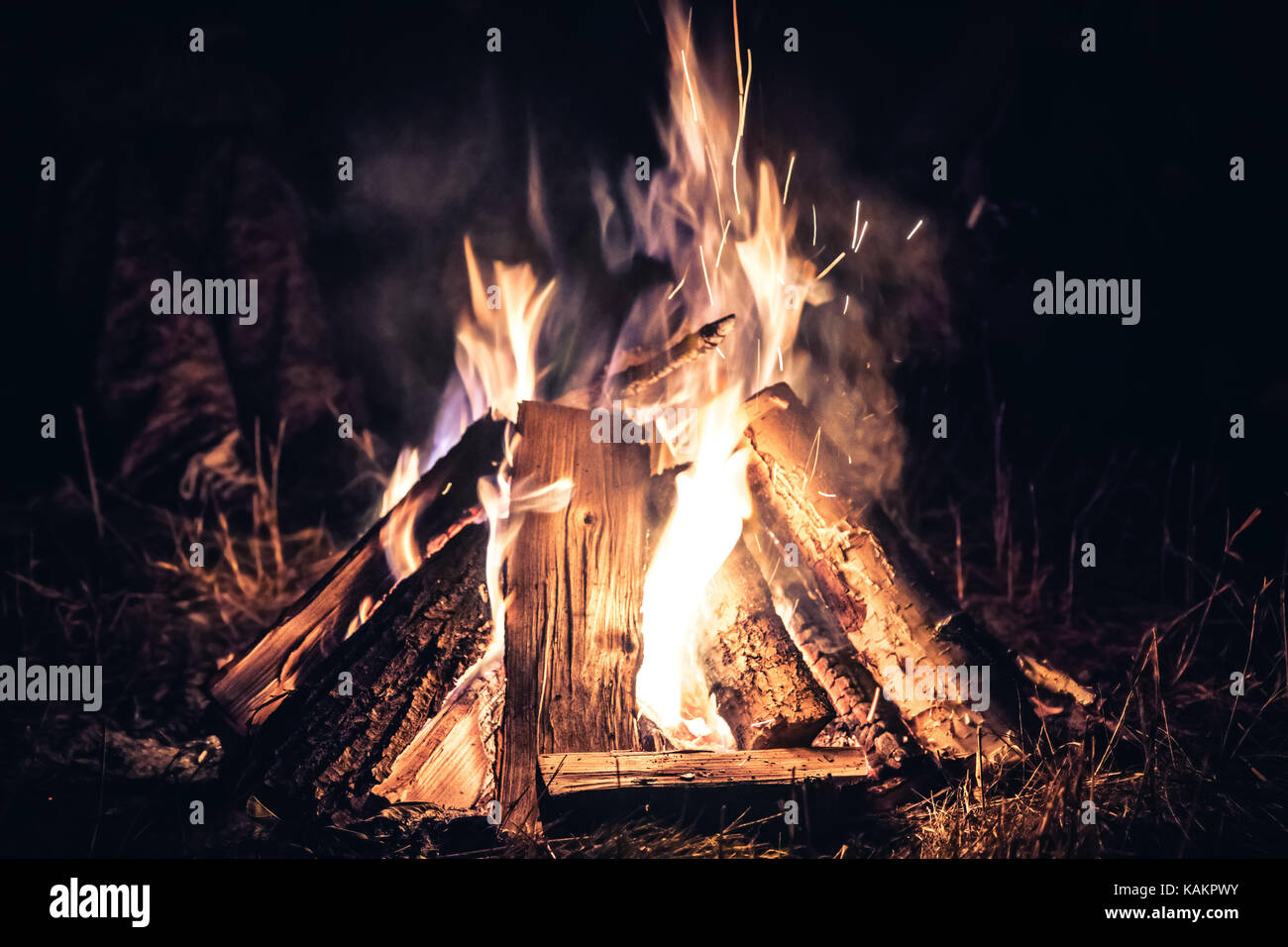 Campfire in night camp during camping holidays Stock Photo - Alamy