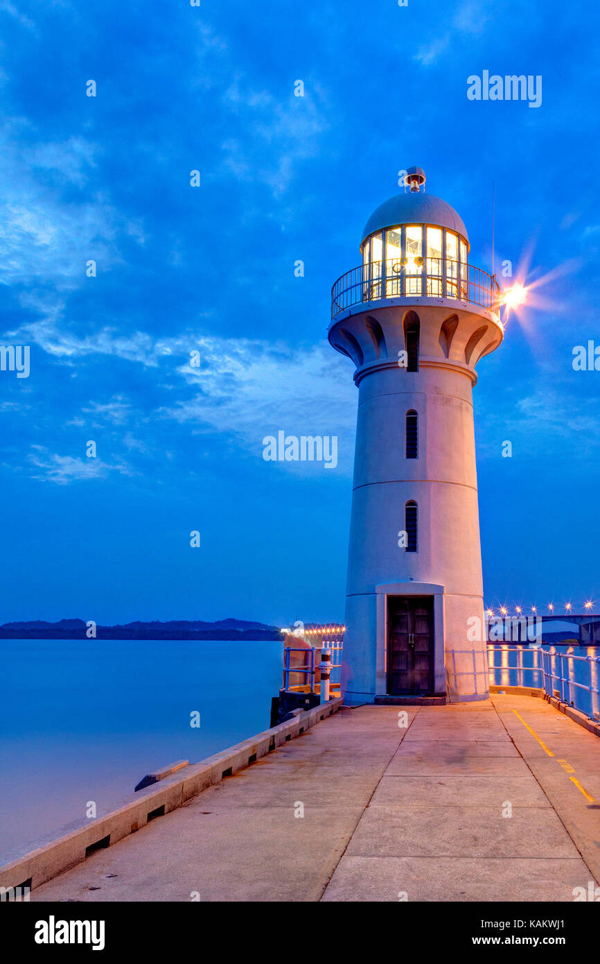 Nightfall on Singapore lighthouse at Tuas Link in the West during ...