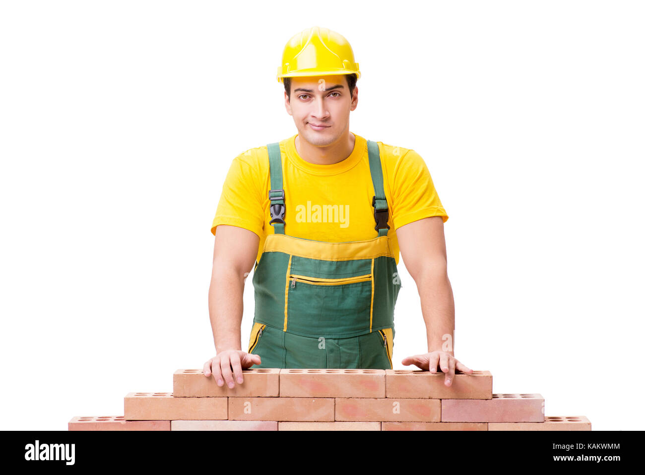 The handsome construction worker building brick wall Stock Photo - Alamy