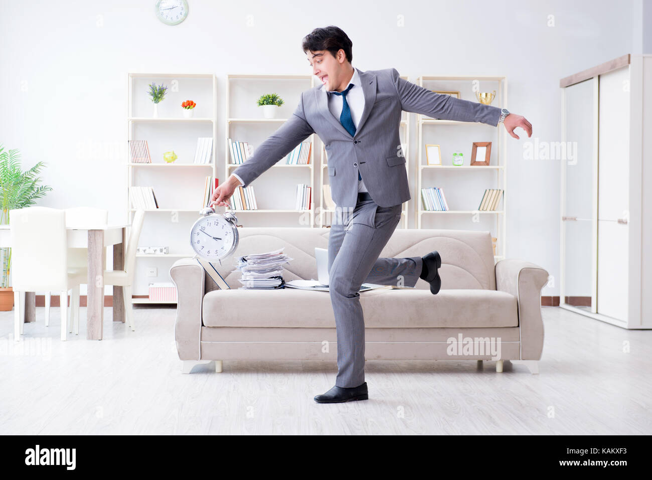 Businessman happy meeting his deadlines Stock Photo - Alamy