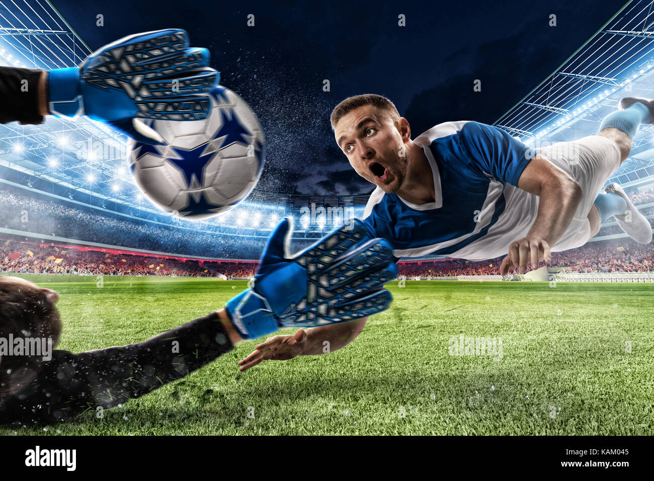 Goalkeeper catches the ball in the stadium Stock Photo - Alamy