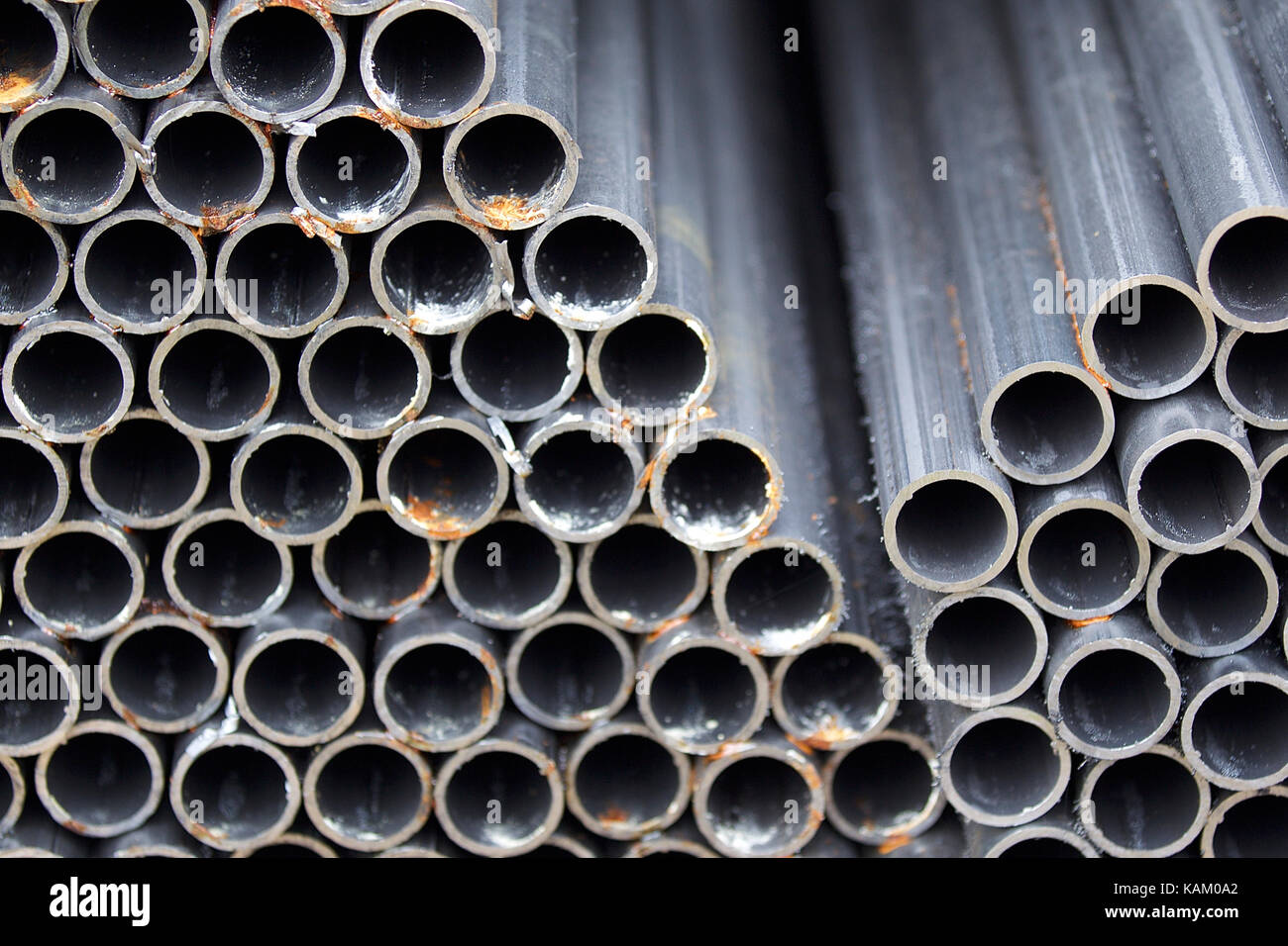 Metal profile pipe of round section in packs at the warehouse of metal ...