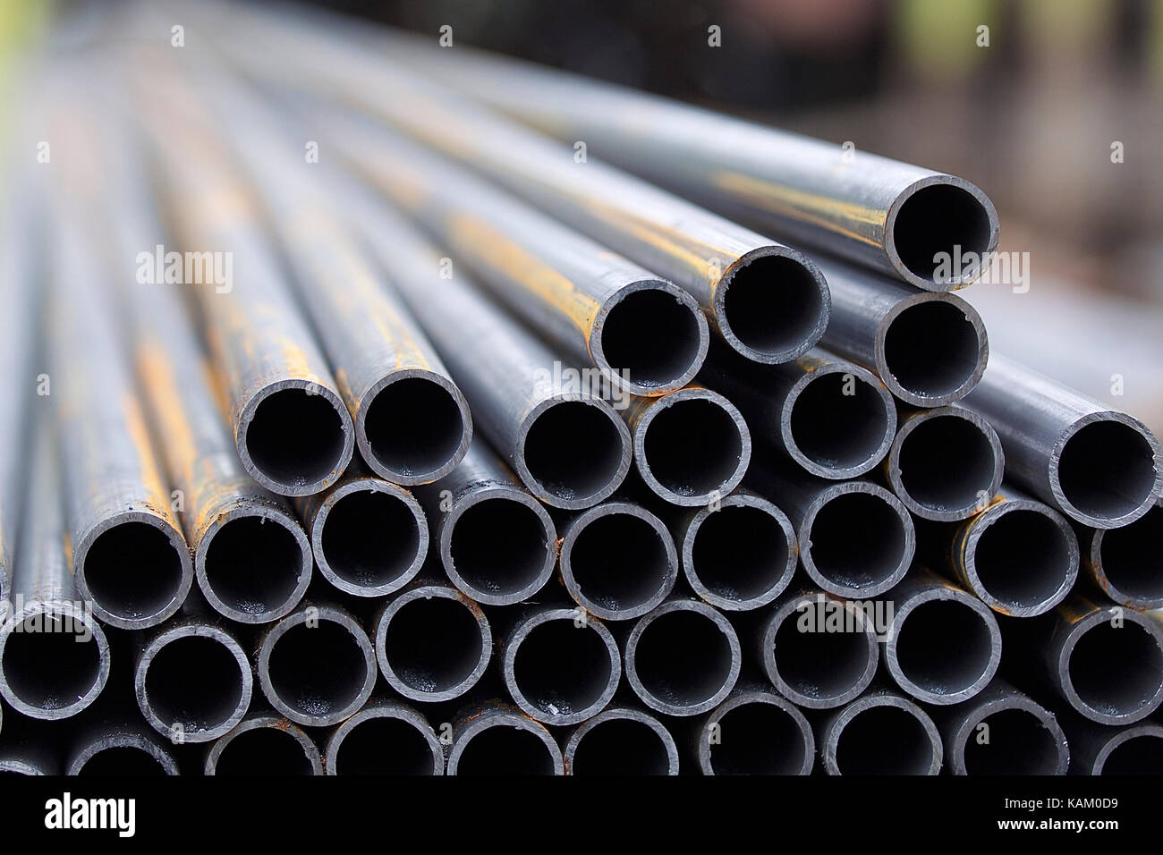 Metal profile pipe of round section in packs at the warehouse of metal ...