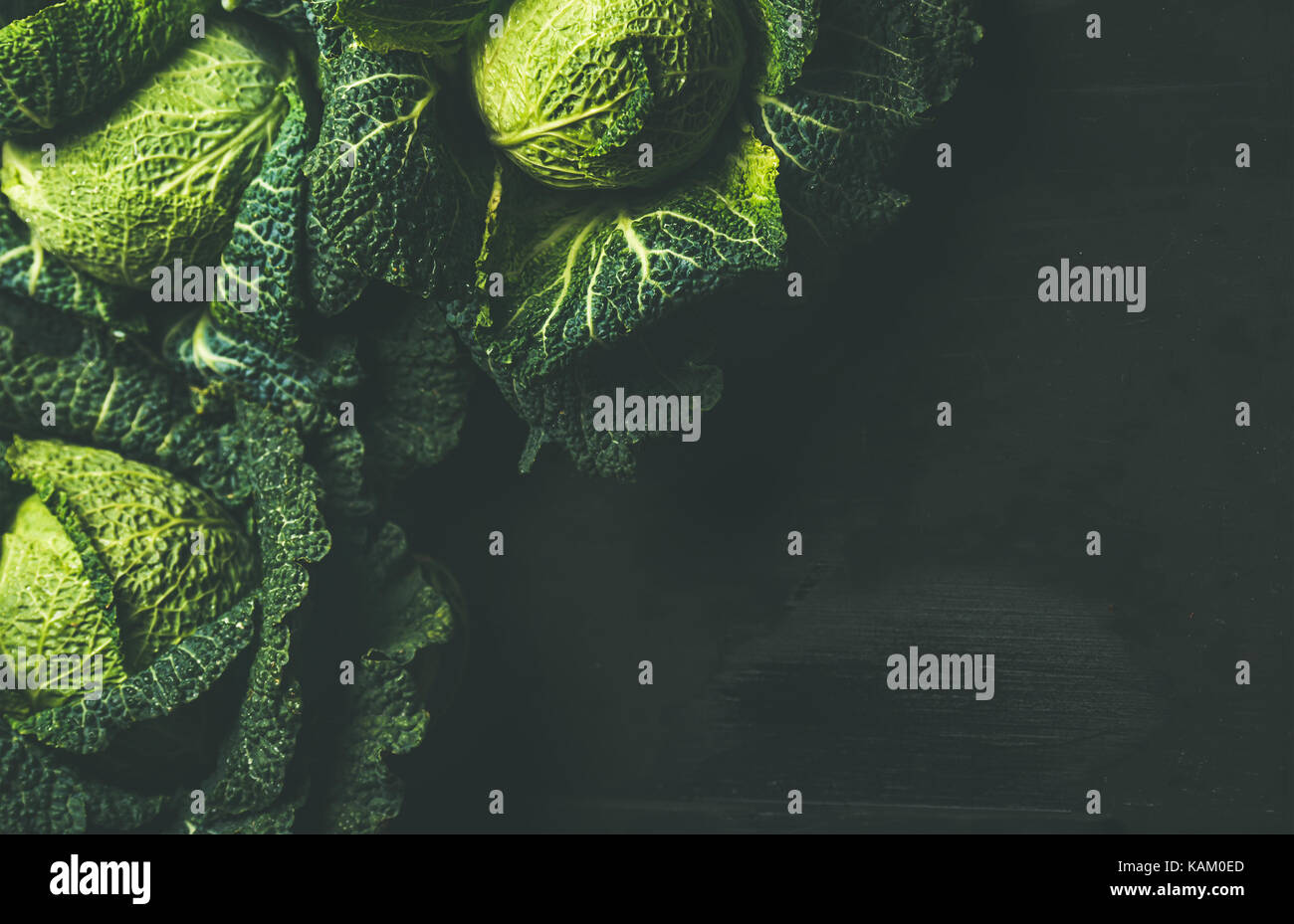 Raw fresh uncooked green cabbage over dark background, copy space Stock ...
