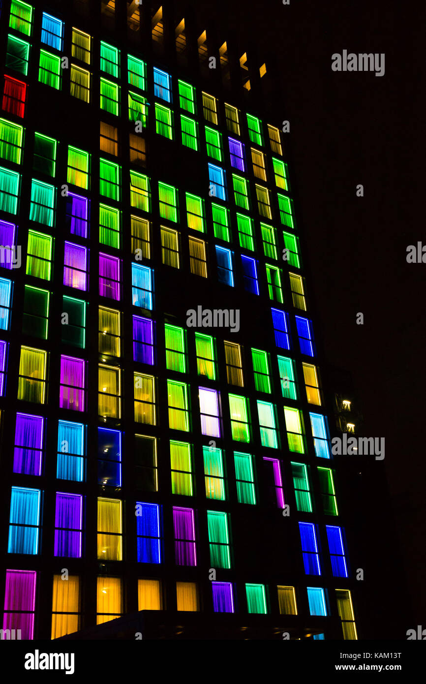 Colored windows texture. Windows illuminated by neon lights background ...