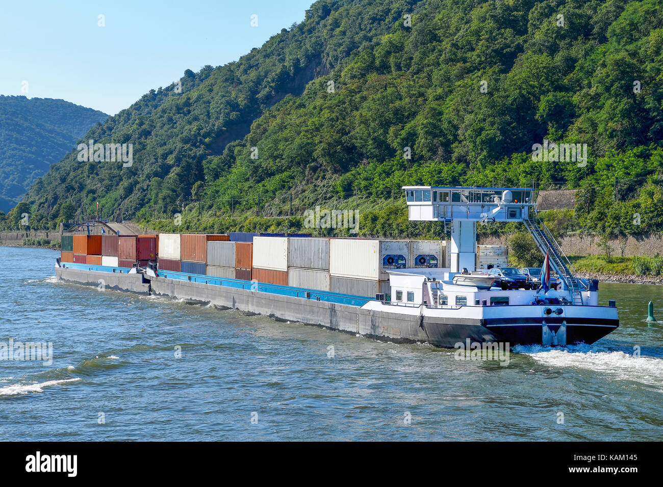 shipping containers transported by barge on Rhine River in Germany ...