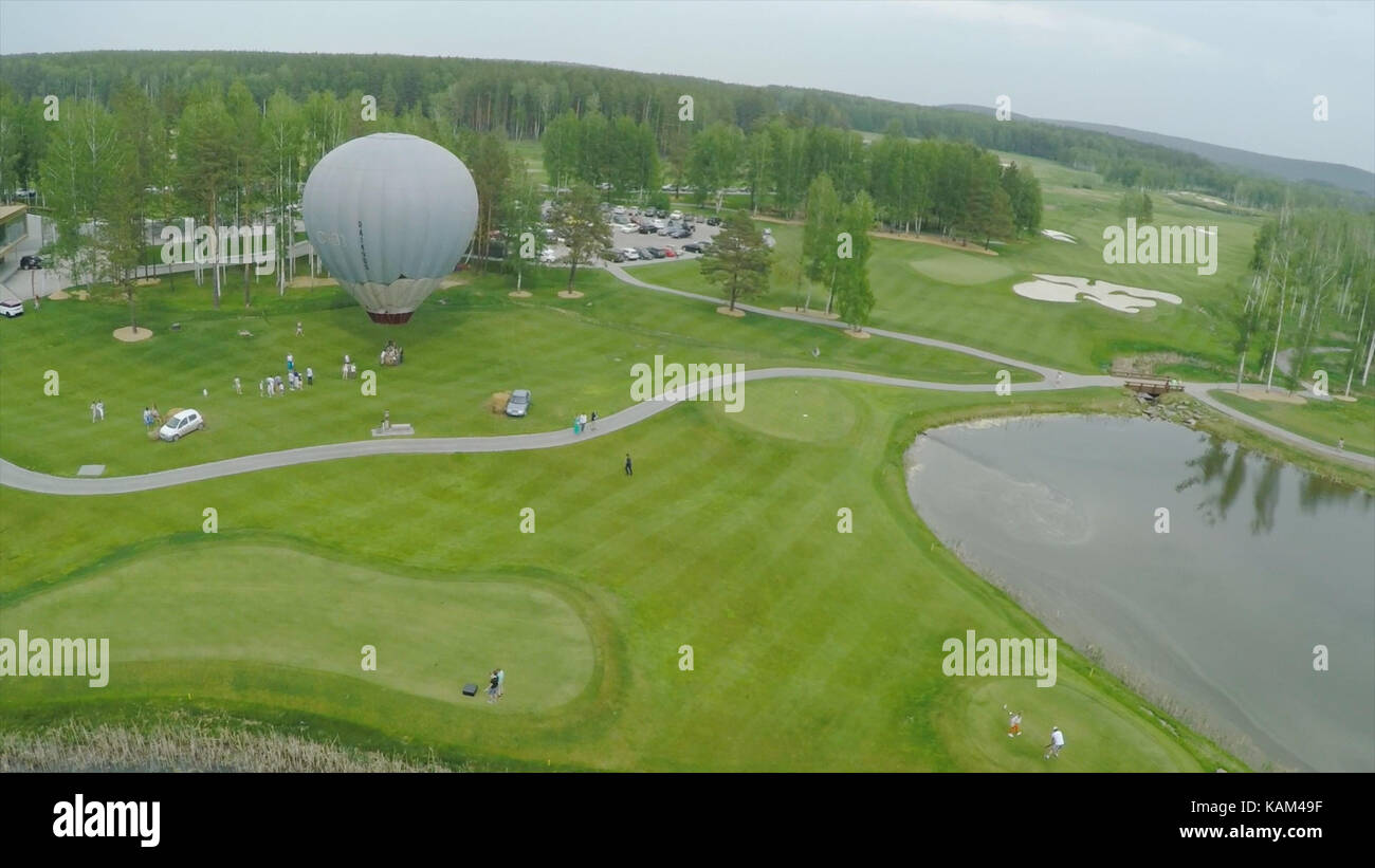 Big air balloon in white color with basket. Aerial on the big balloon ...