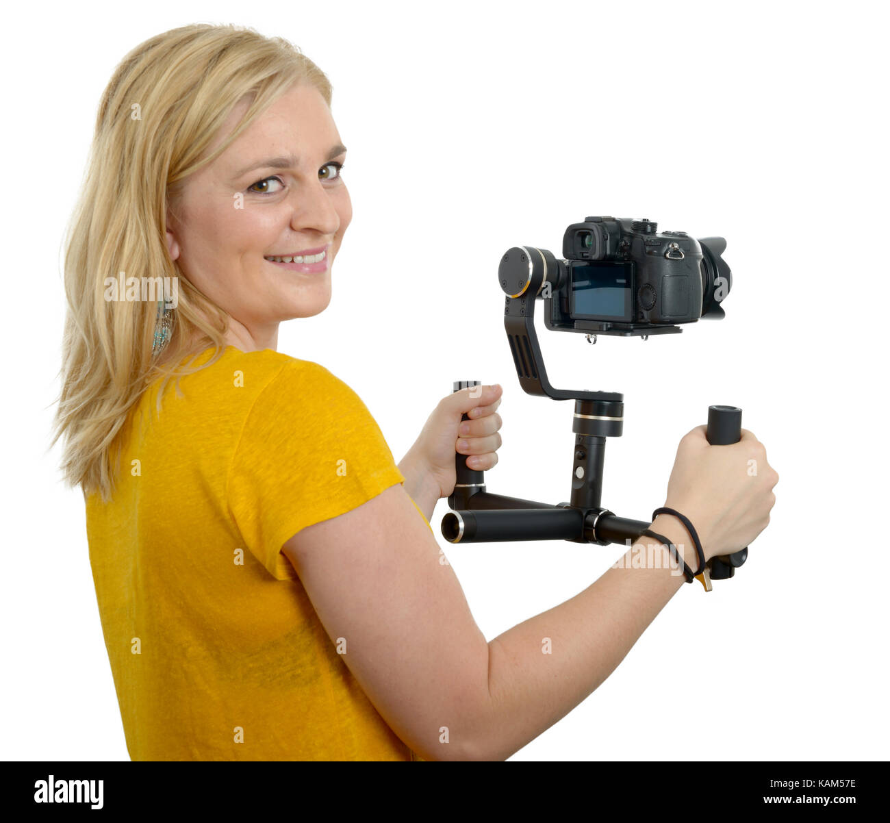 young woman videographer using steady cam Stock Photo - Alamy
