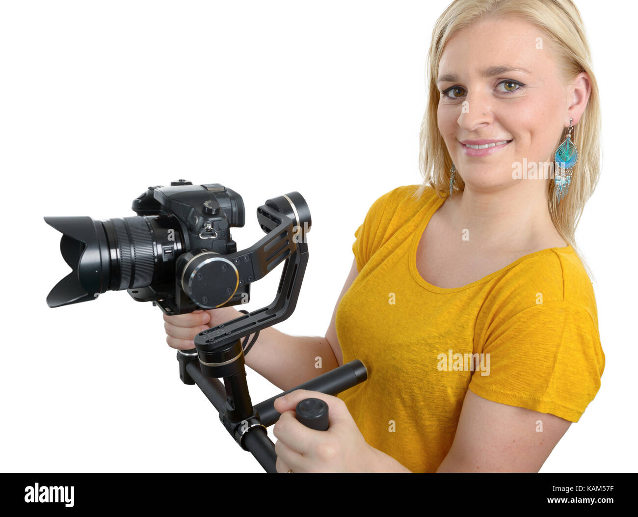 young woman videographer using steady cam Stock Photo - Alamy