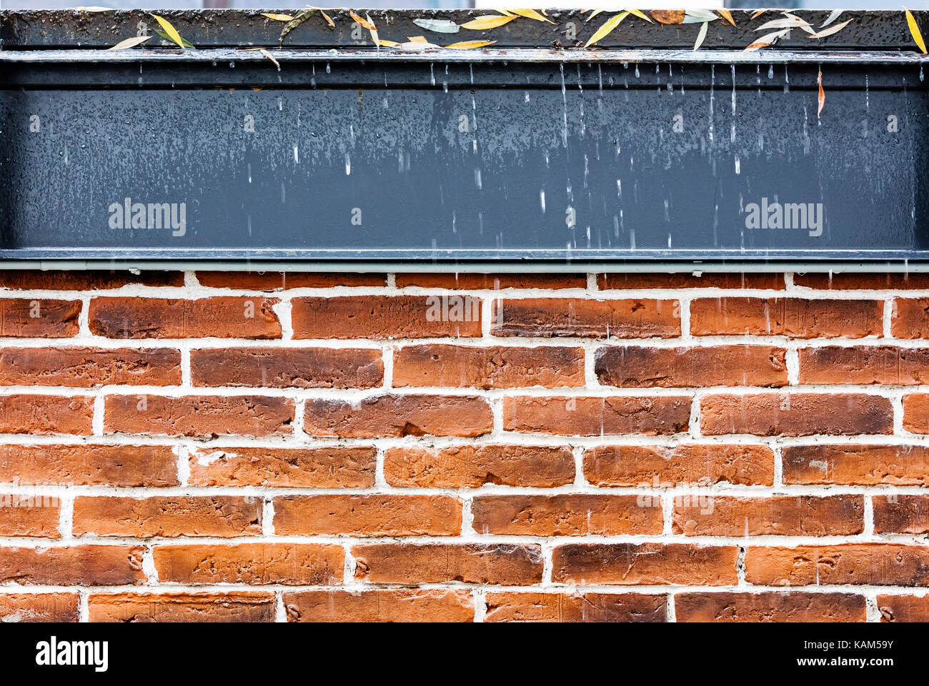 red brick wall with metal beam under the heavy rain Stock Photo - Alamy