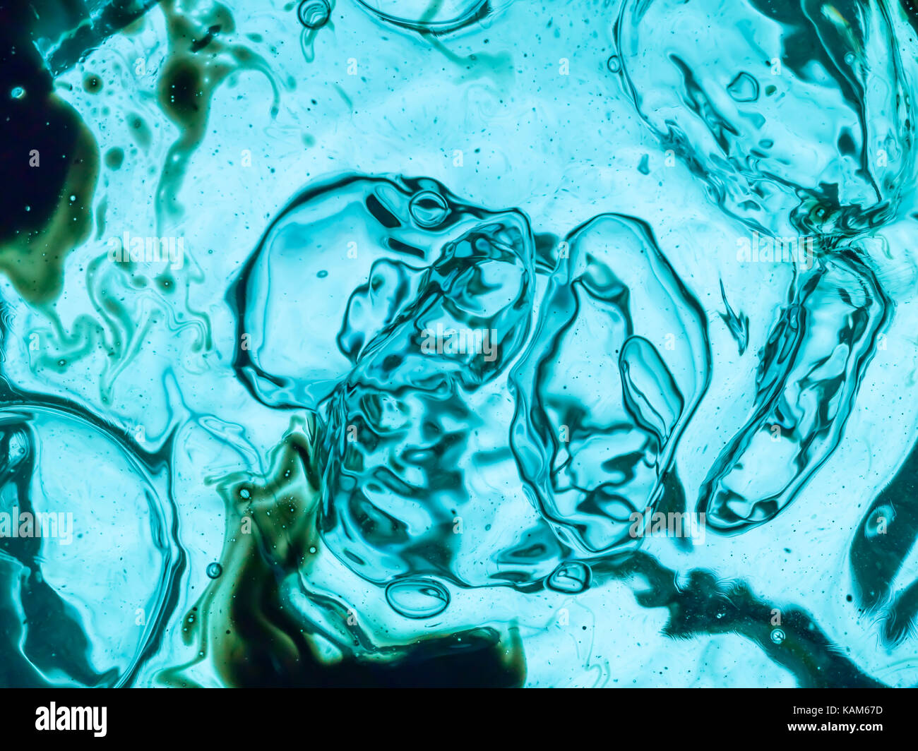 Water full of impurities and polluted with burned oil Stock Photo - Alamy