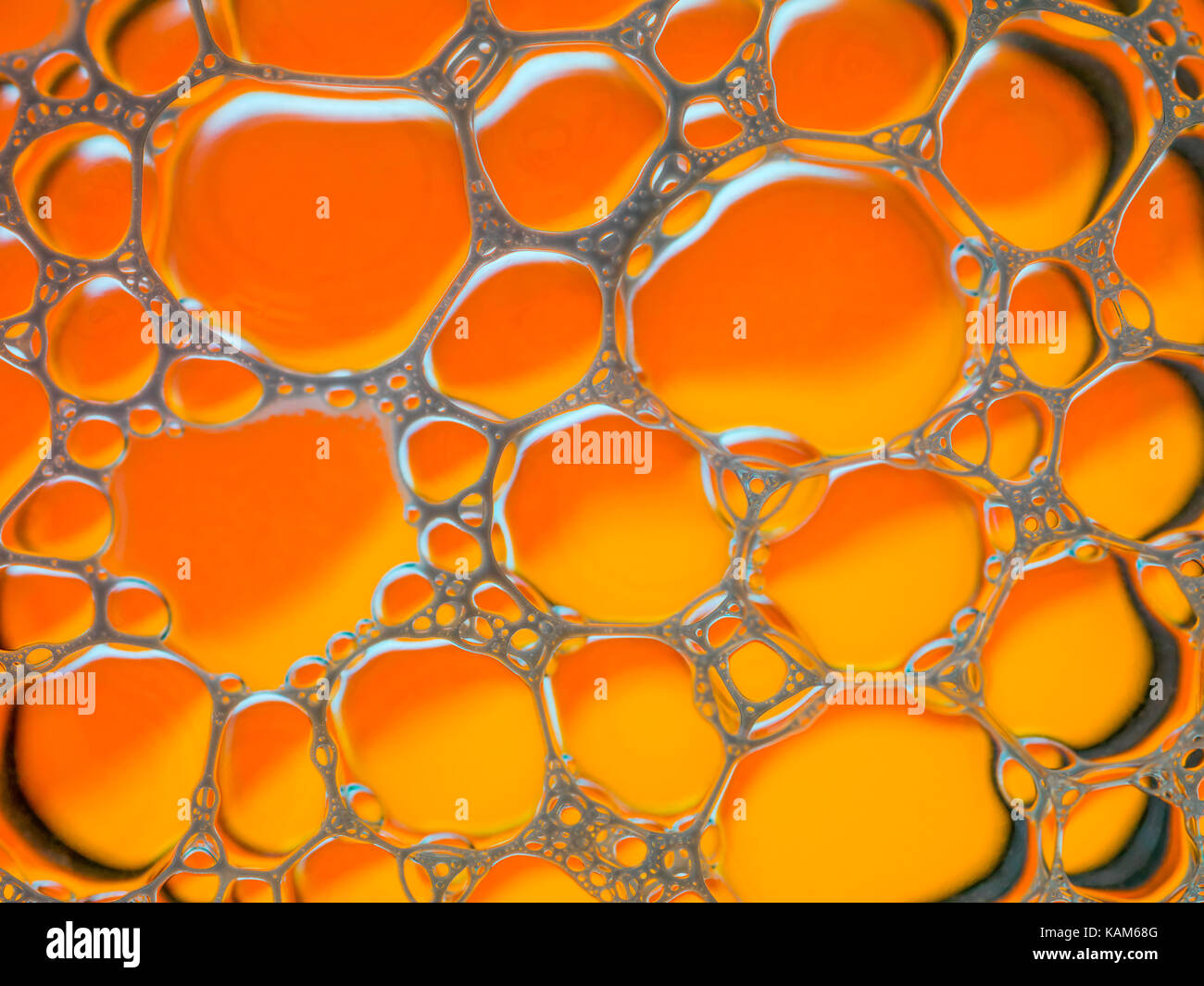 soap bubbles orange liquid background Stock Photo - Alamy