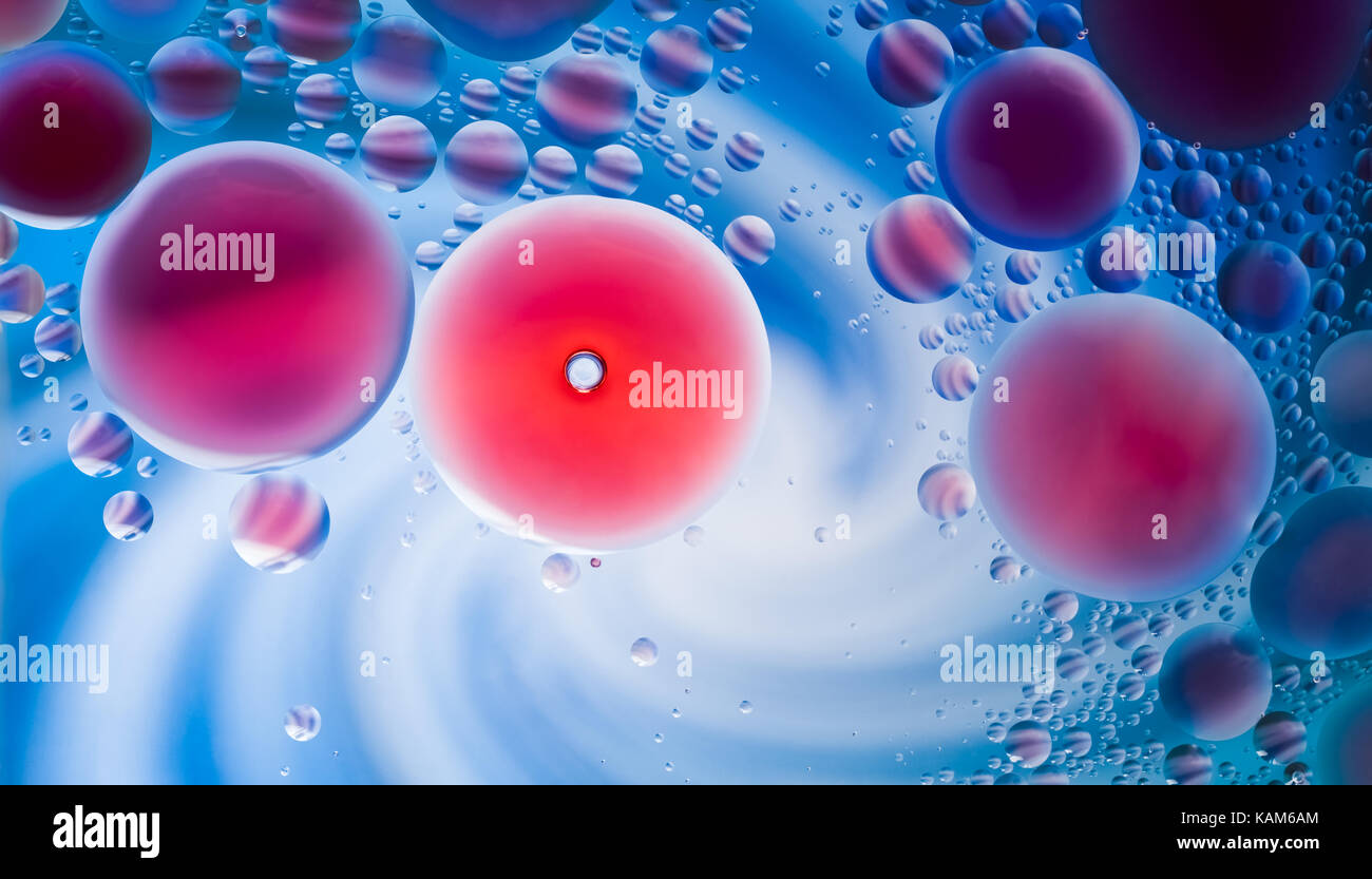 vortex of oil-stained planets on the surface of the water Stock Photo ...
