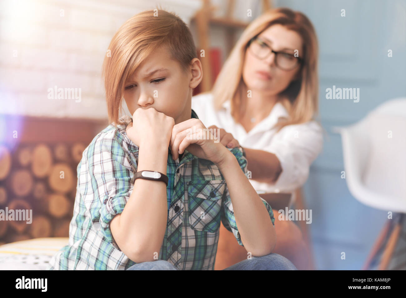Troubled boy getting support from a professional psychologist Stock ...