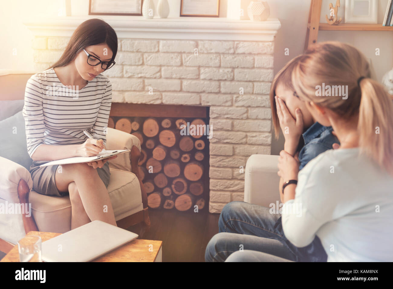 Professional psychologist having a psychological session Stock Photo ...
