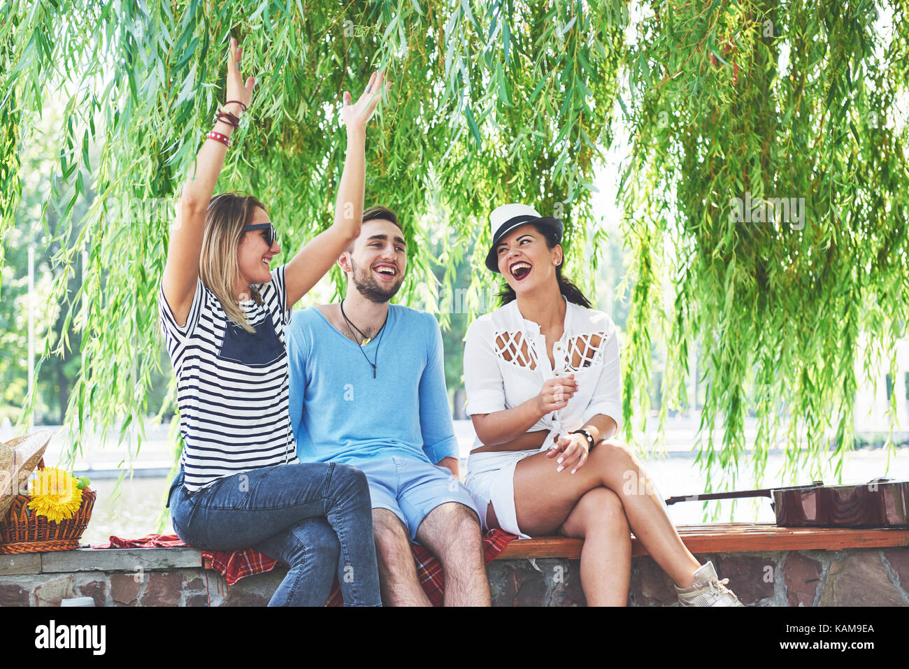 Group of friends relaxing and playing together. Young people chat on ...