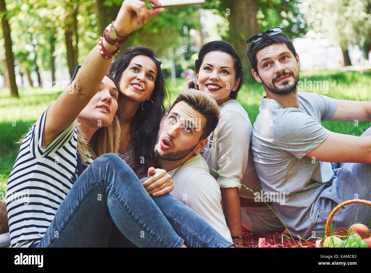 Happy friends having fun outside in nature Stock Photo - Alamy