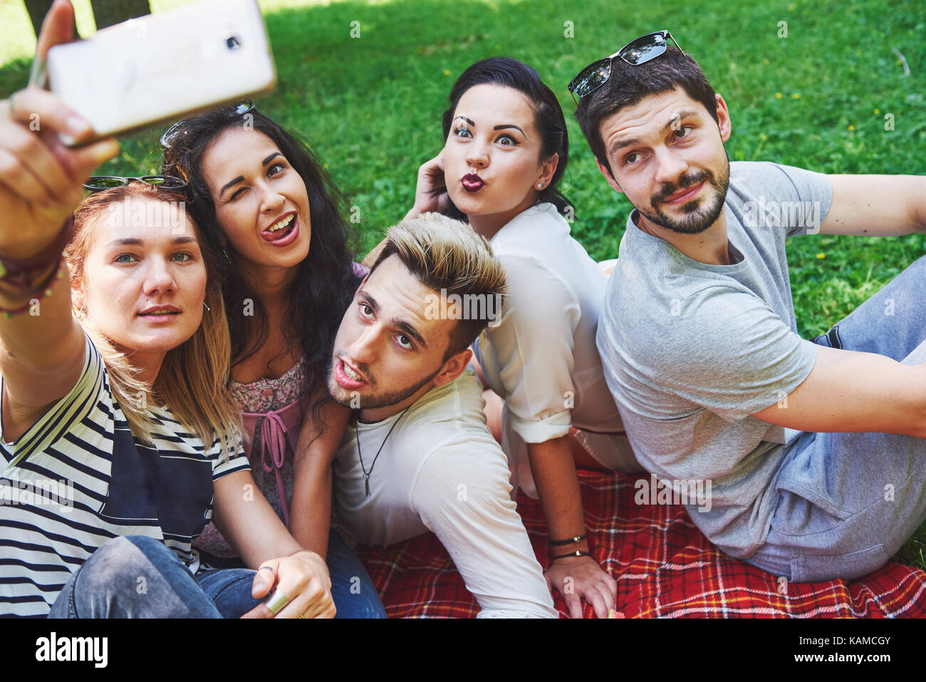 Happy friends having fun outside in nature Stock Photo - Alamy