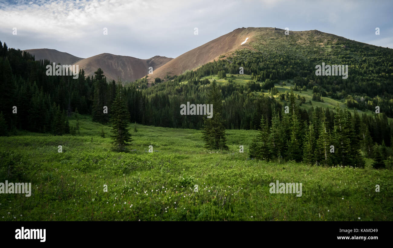 View of the valley, mountain ridges and red scree slopes from the main ...