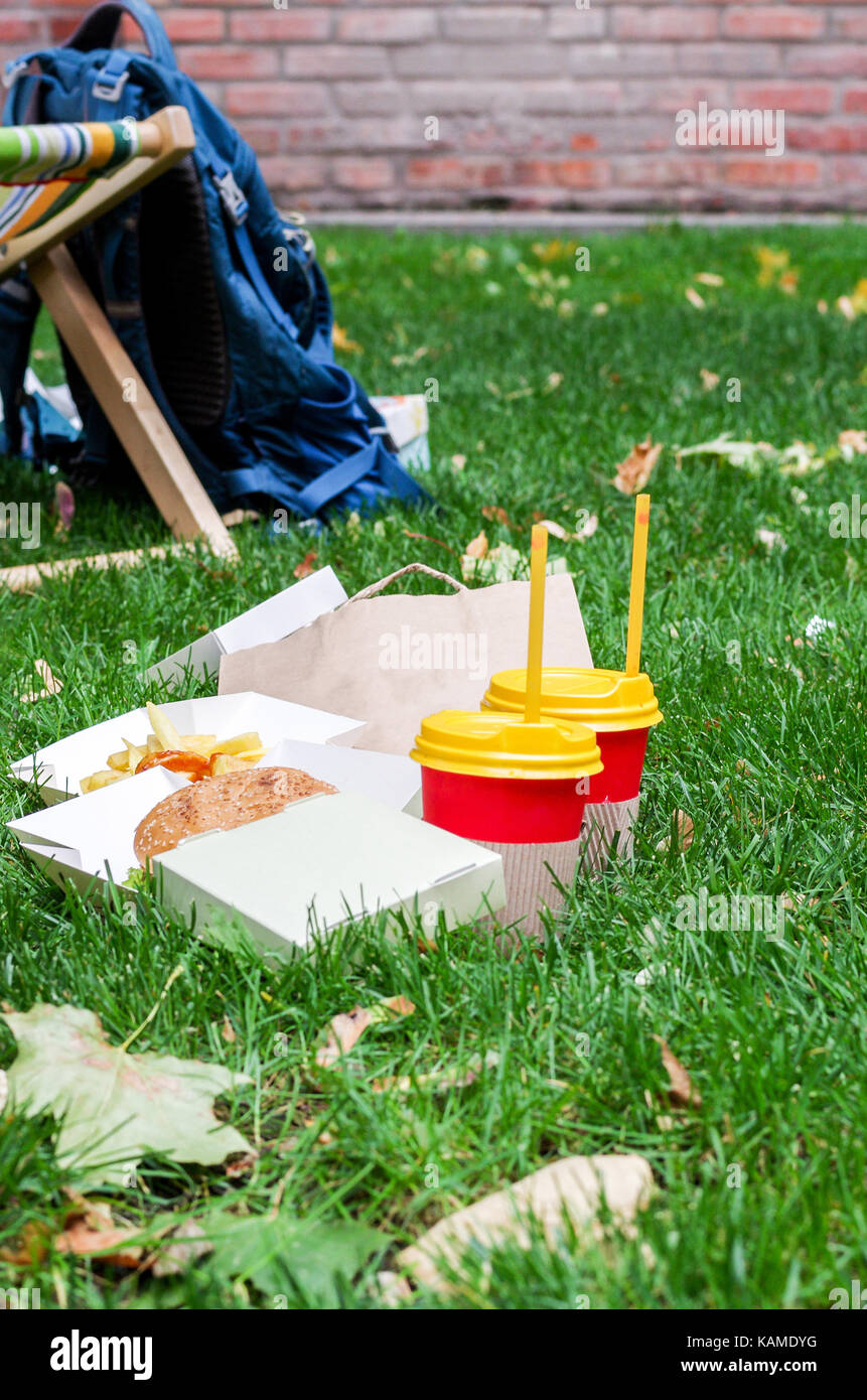 Two drinks and two sandwiches. Snack for two people. Green grass Stock ...