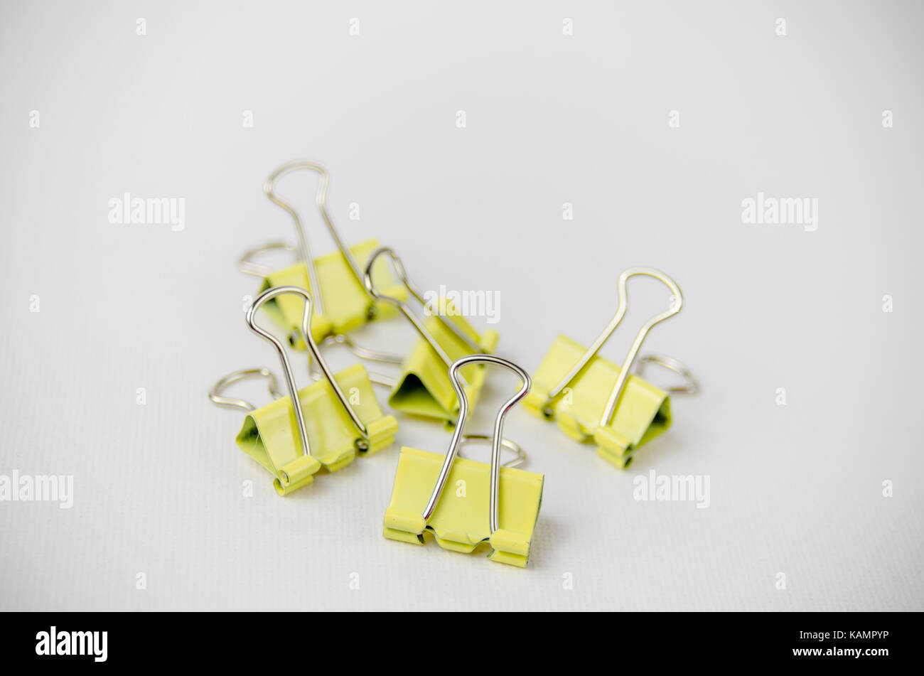 A Studio Photograph of a Group of Yellow Bulldog Clips Stock Photo - Alamy