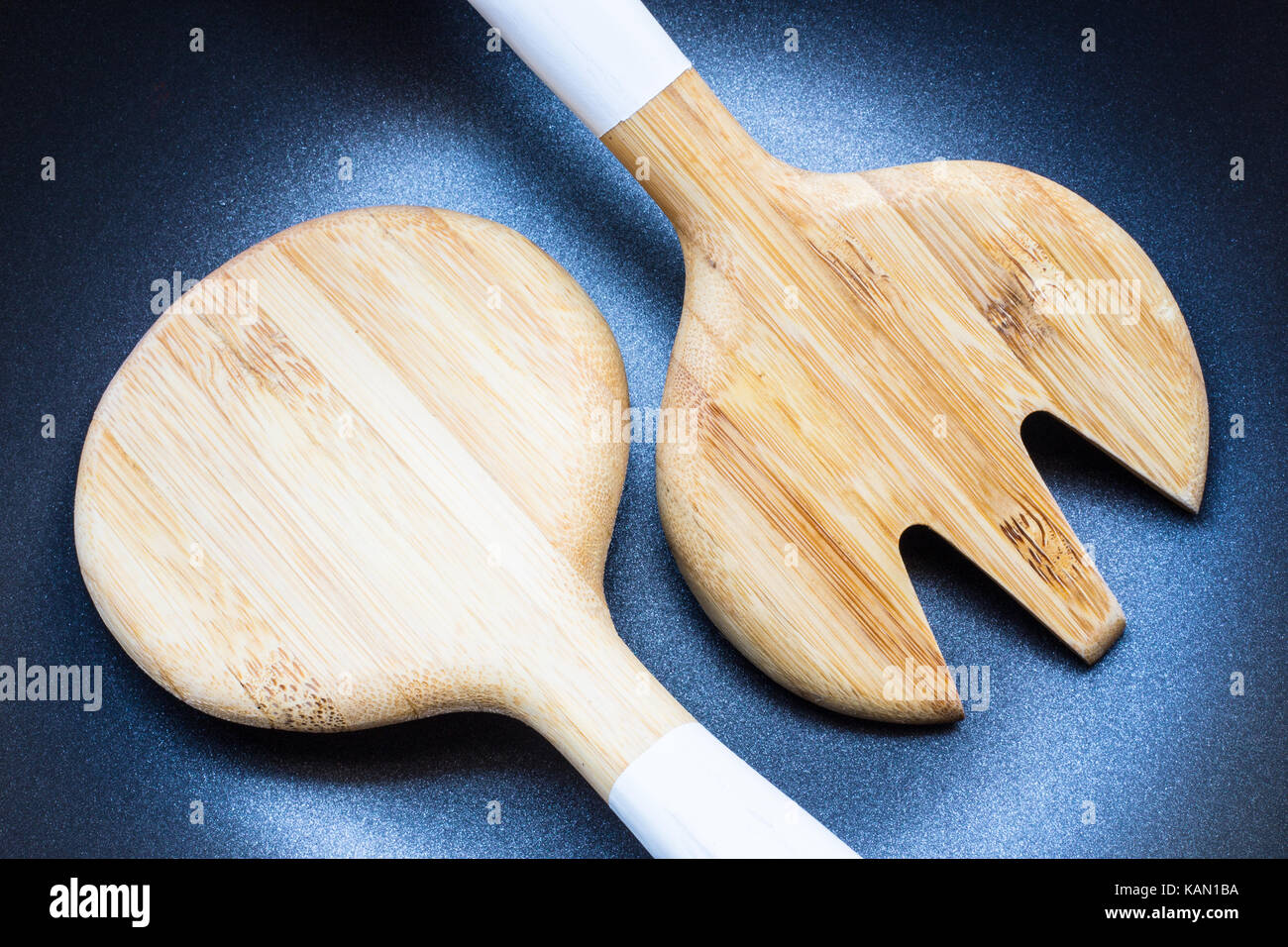 Close up of wooden spatula on coating pan background Stock Photo - Alamy