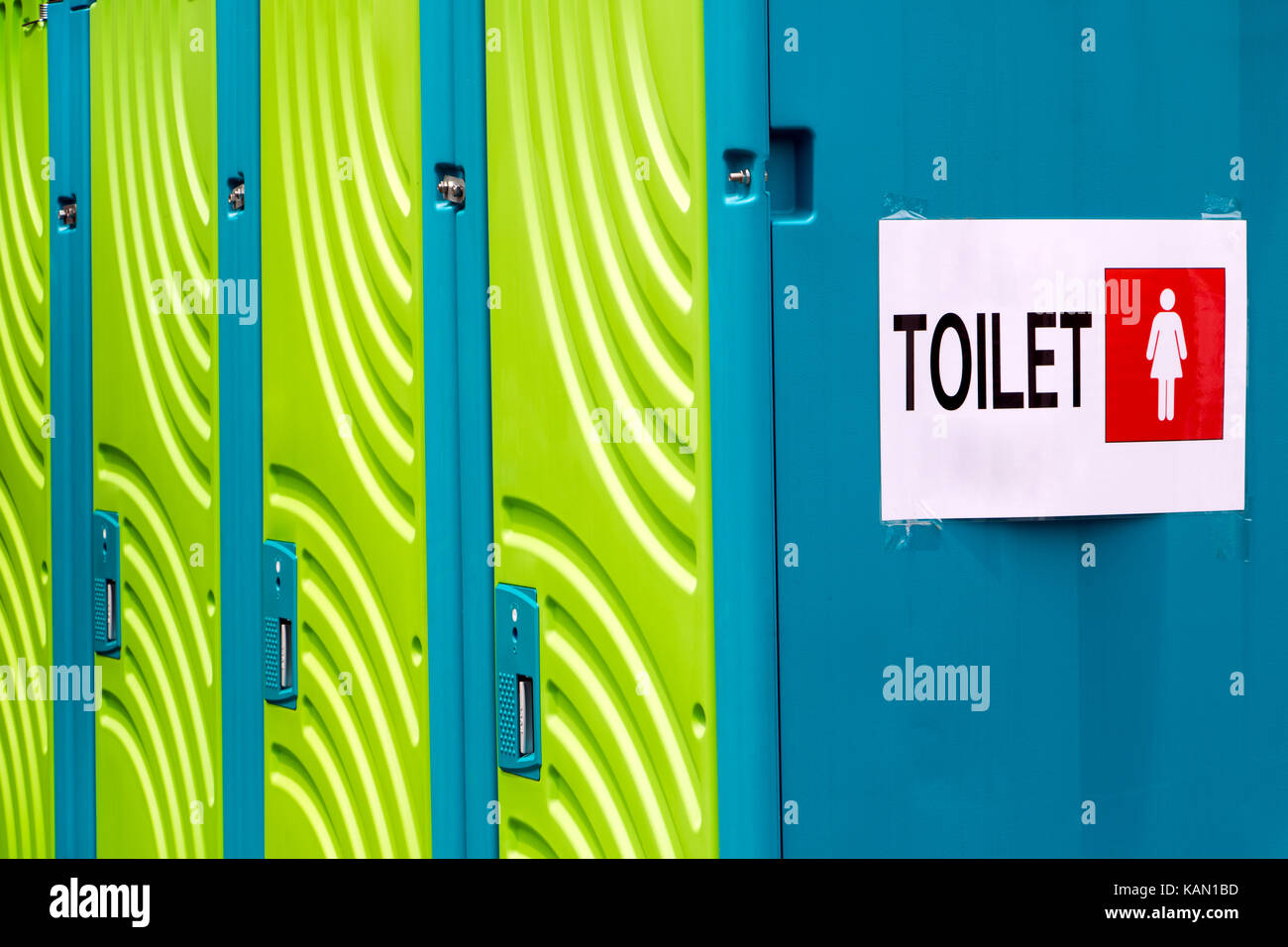 Portable toilets for women. Female toilets. A row of outdoor toilets ...