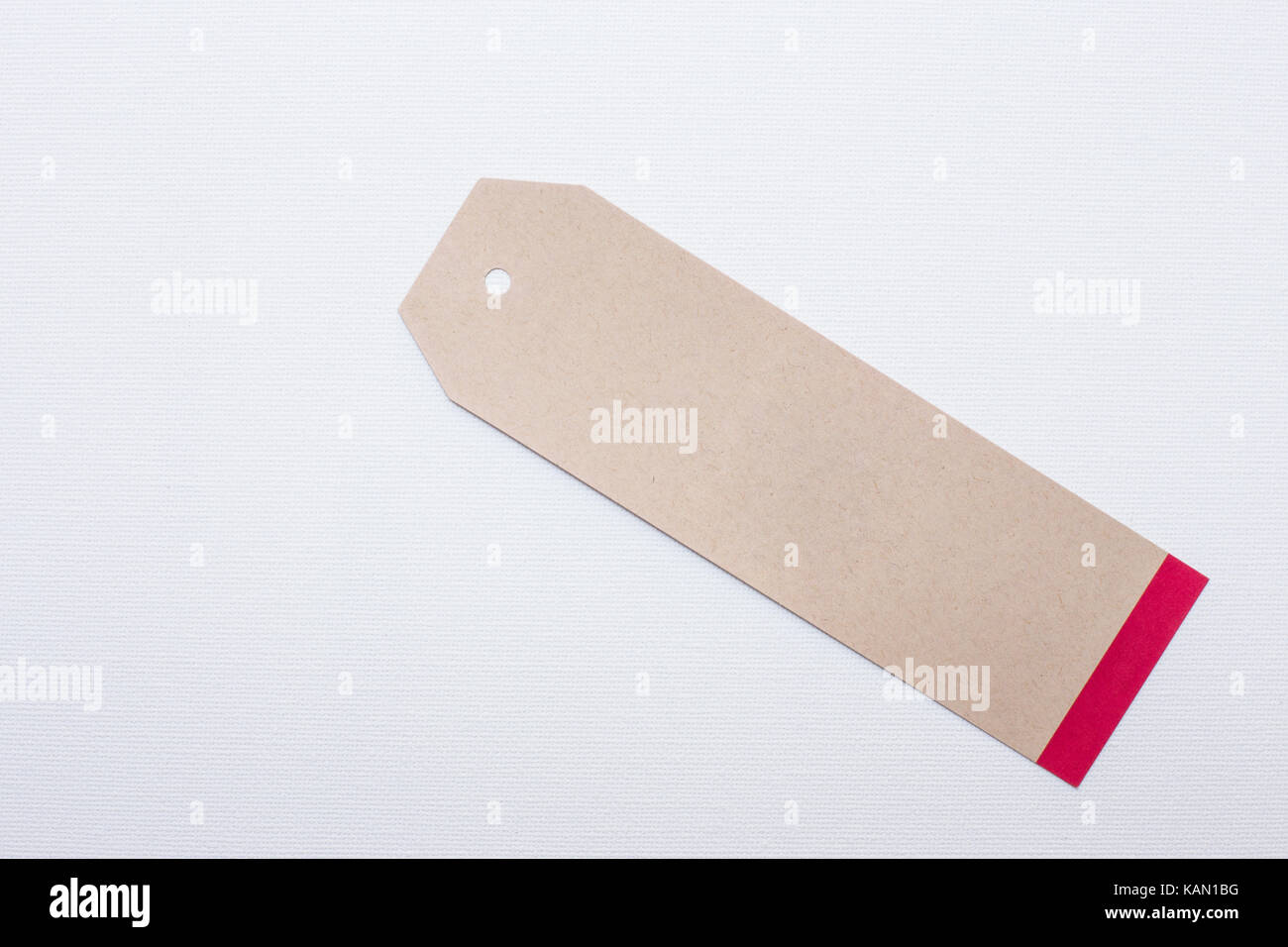 Close up of paper tag on white canvas background Stock Photo - Alamy